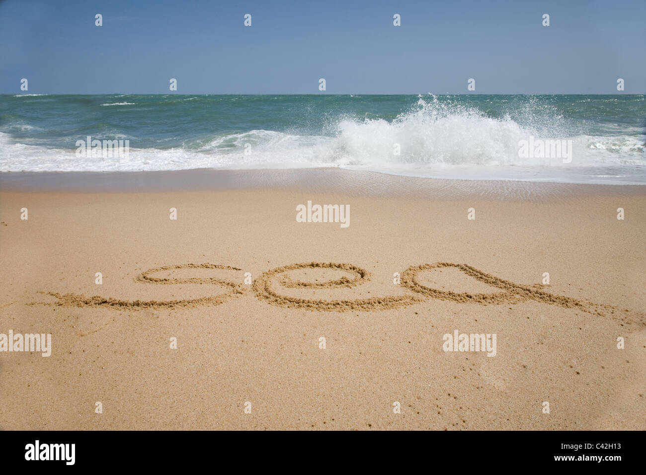 Sea written in sand Stock Photo - Alamy