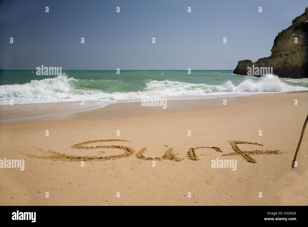 Surf written in sand Stock Photo - Alamy