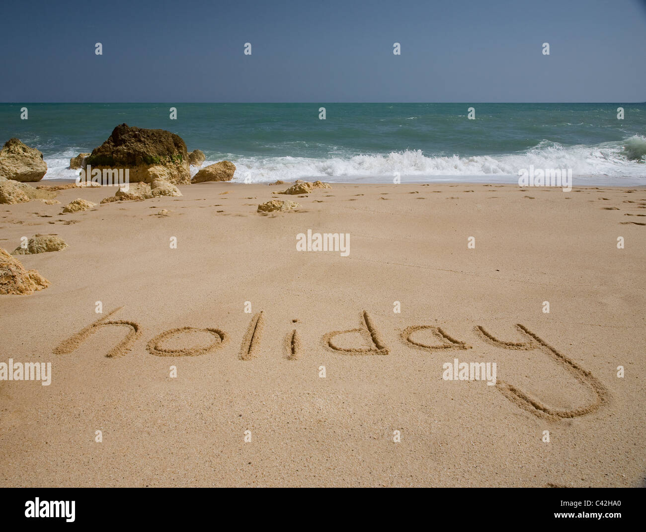 Holiday Writing in the Sand Stock Photo - Alamy