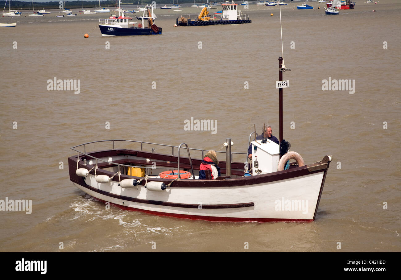 The small ferry boat crosses the River Deben between Bawdsey Quay and ...