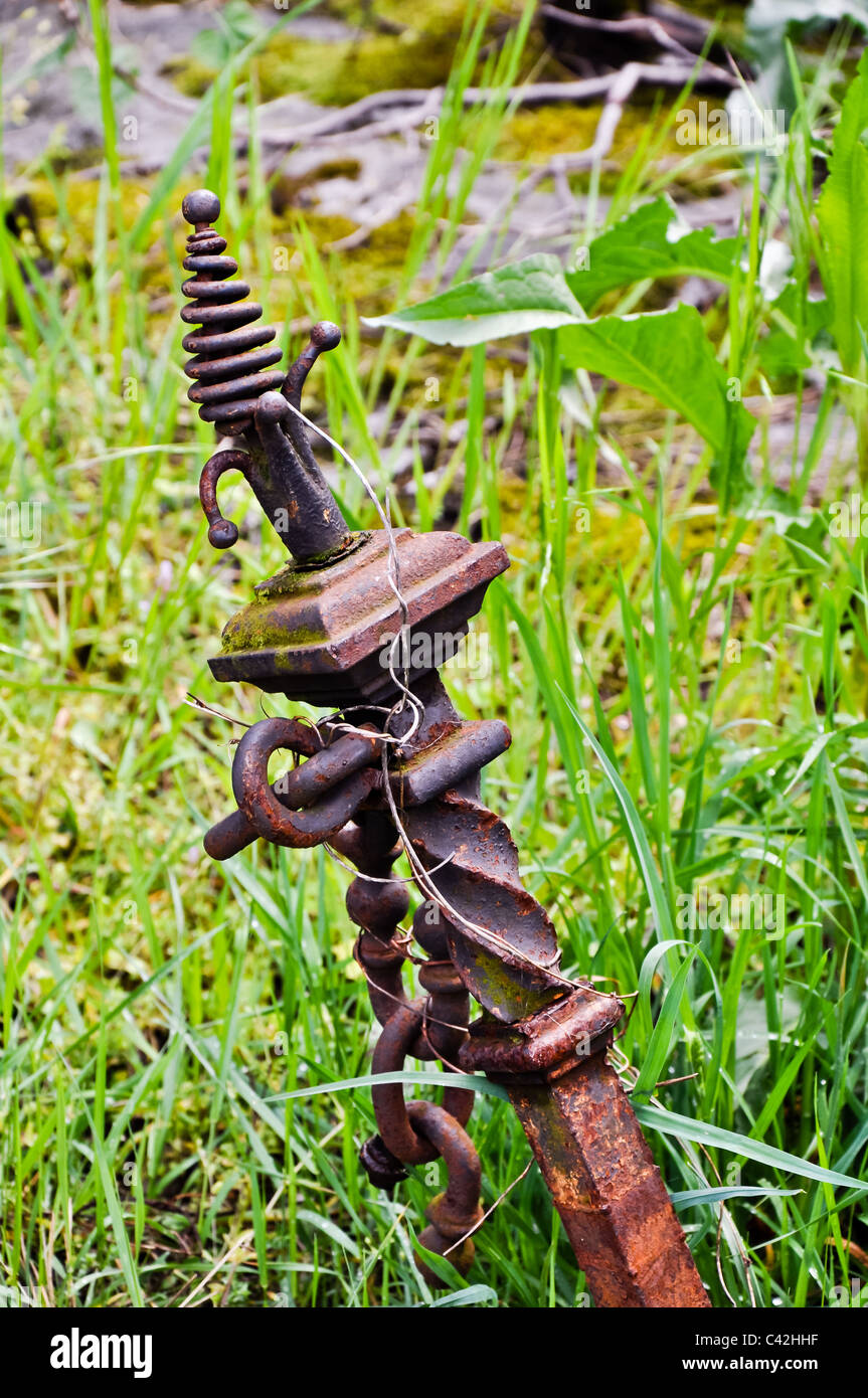 a rusty ornamental iron pole in a withering meadow Stock Photo - Alamy