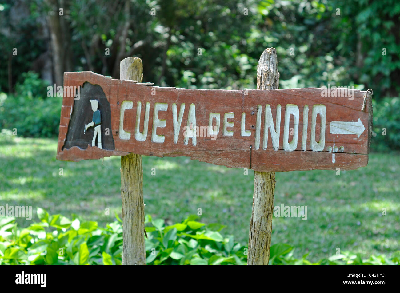 A handmade directional signpost, pointing directions to an underground ...