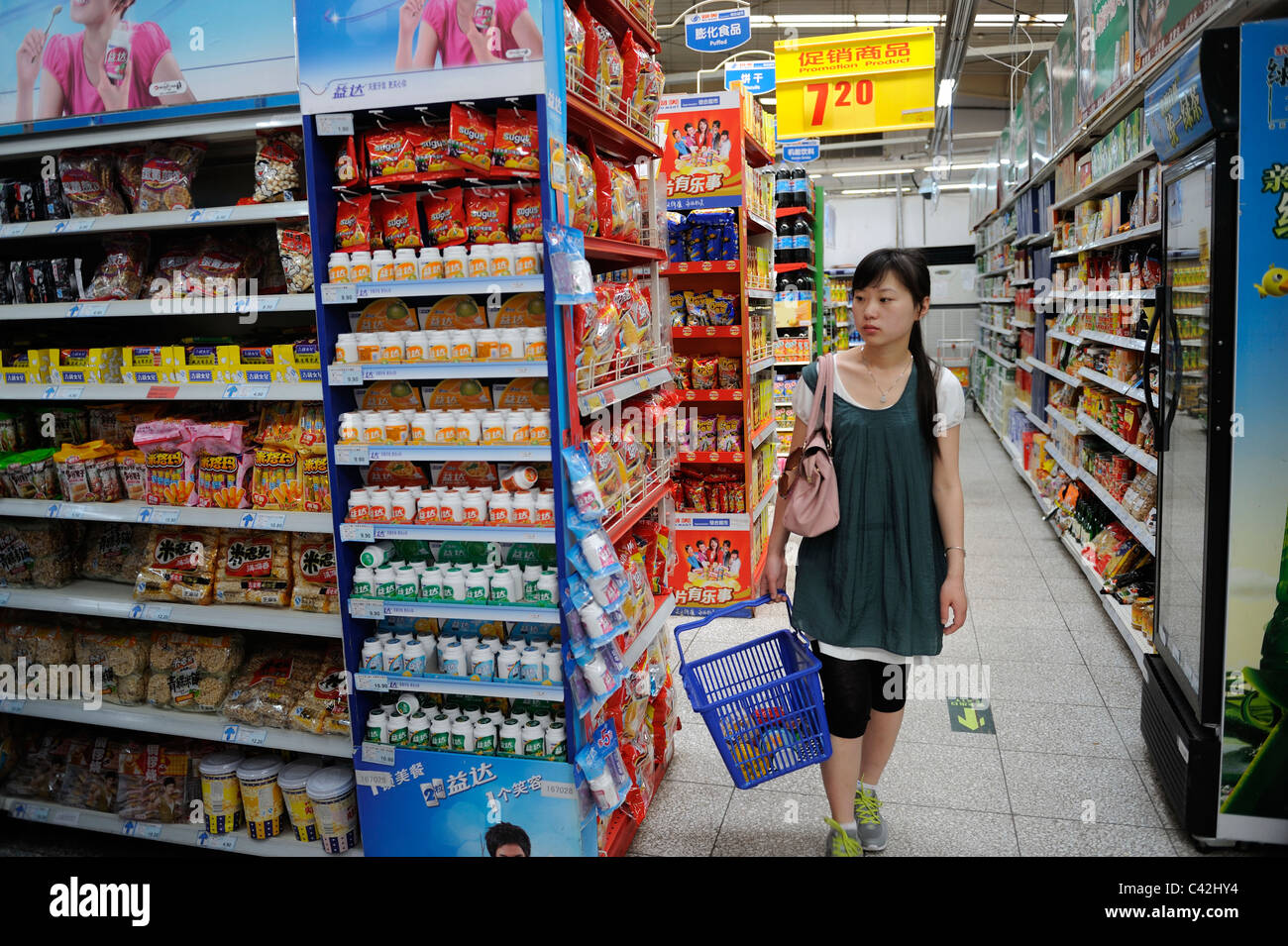Chinese lady shopping at a Wu Mart supermarket in Beijing, China.28-May ...