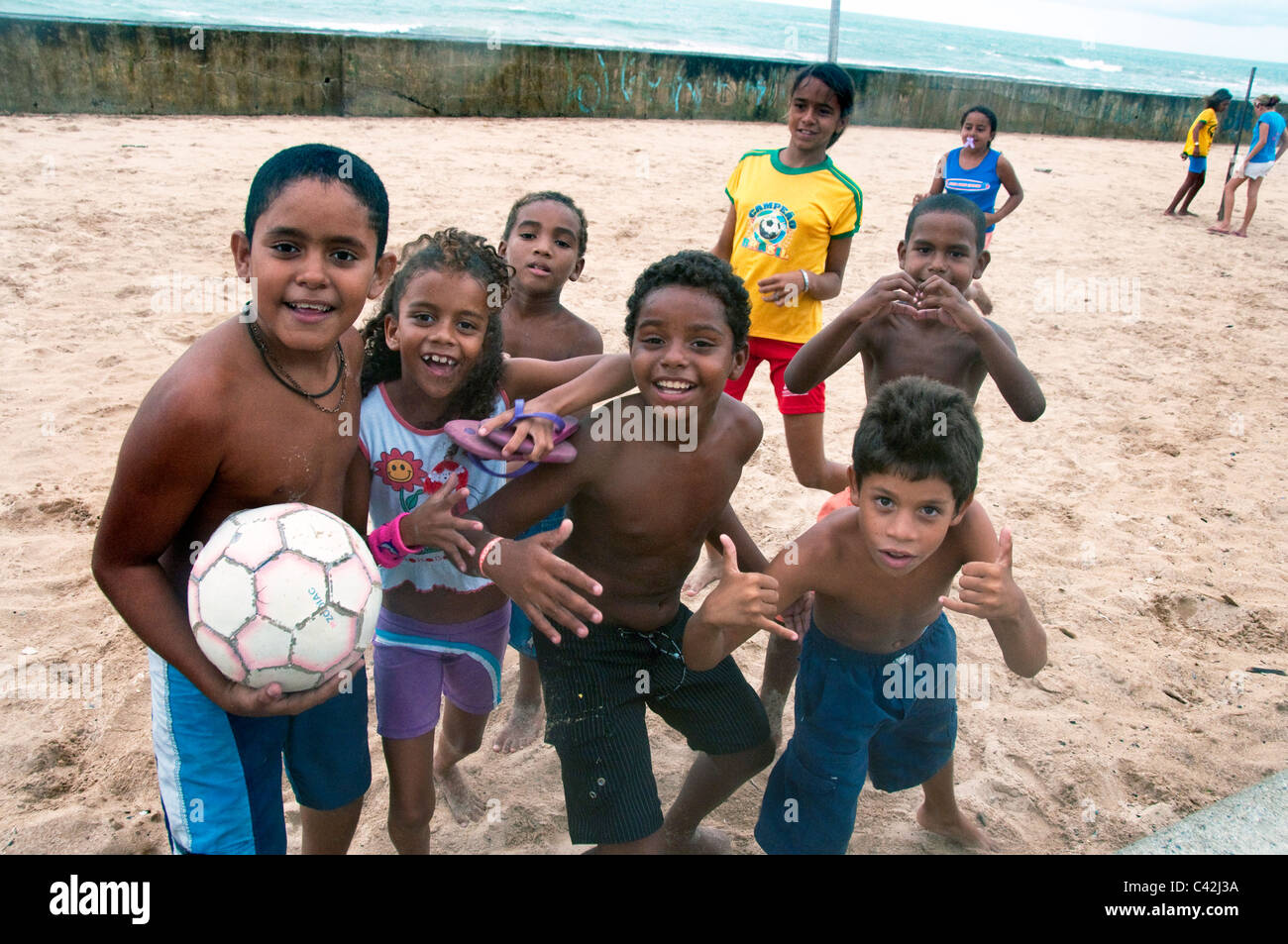 Brazilian children playing football on hi-res stock photography and ...