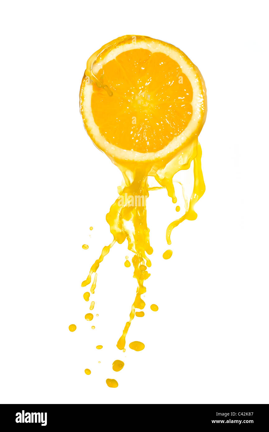 orange juice splash isolated on white background Stock Photo - Alamy