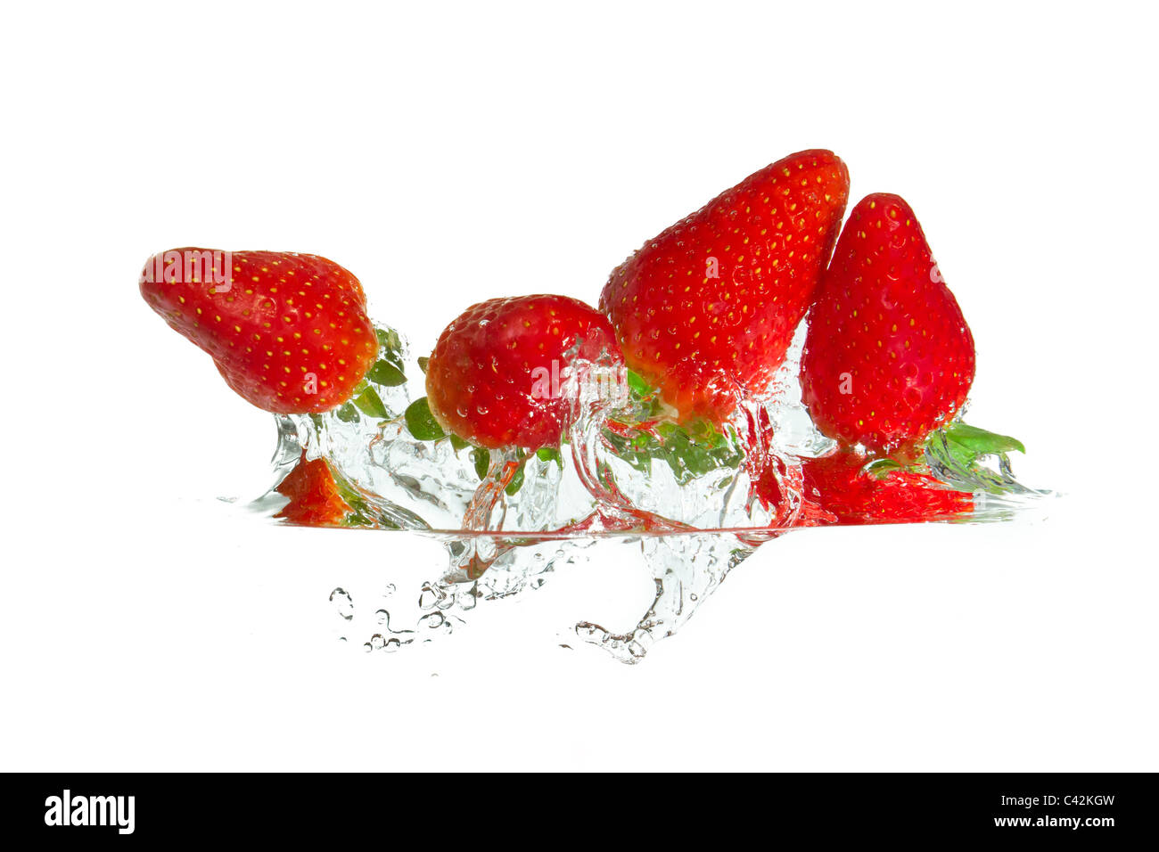 Strawberry splash on white background hi-res stock photography and ...