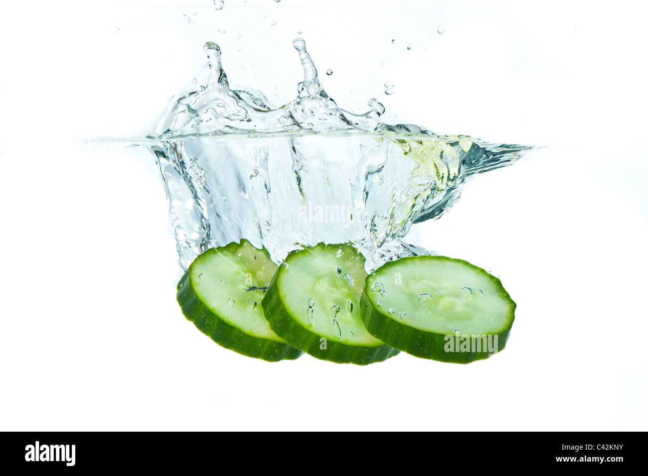sliced cucumber splashing water isolated on white background Stock ...
