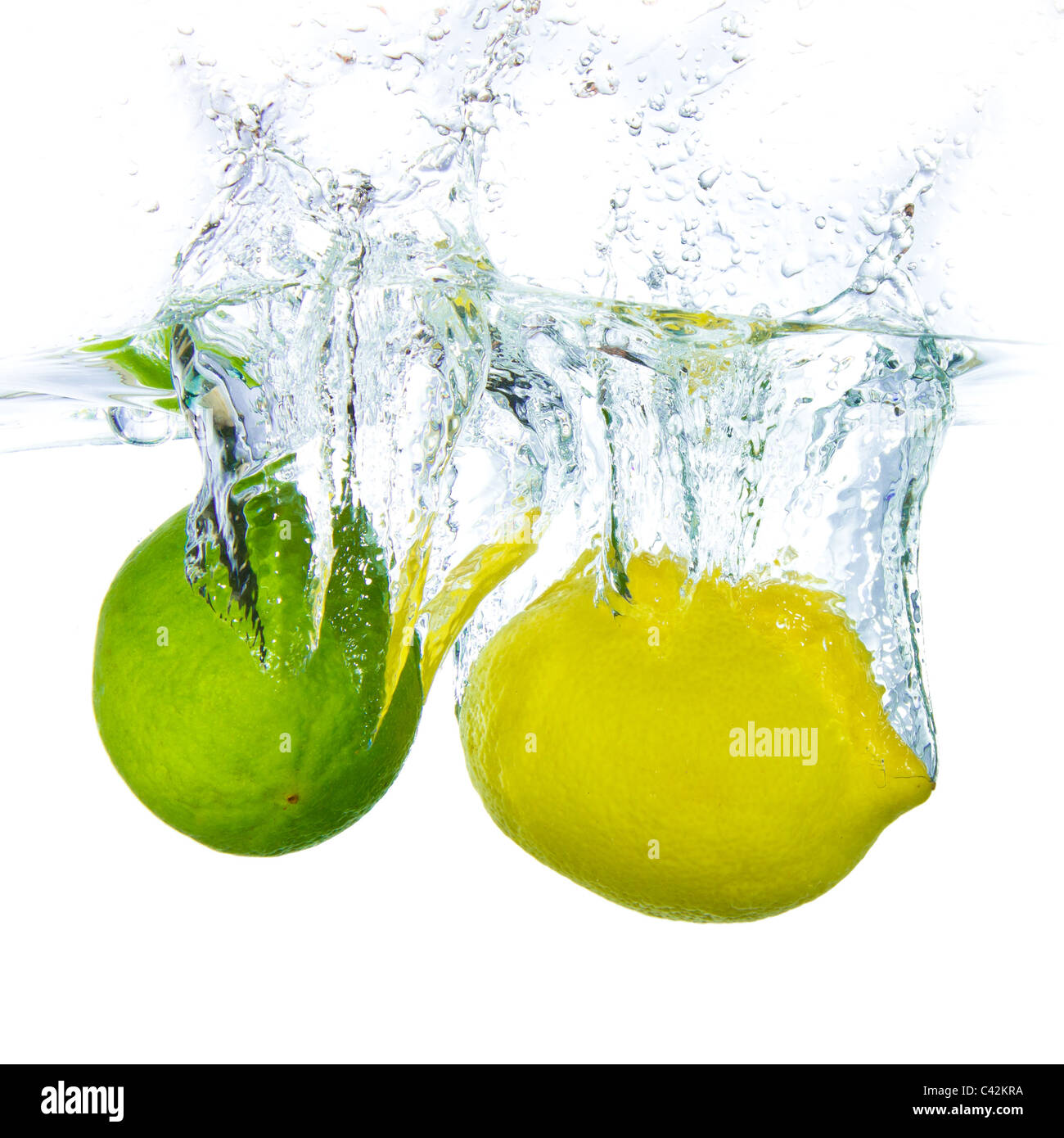 lime and lemon splashing water isolated on white background Stock Photo ...