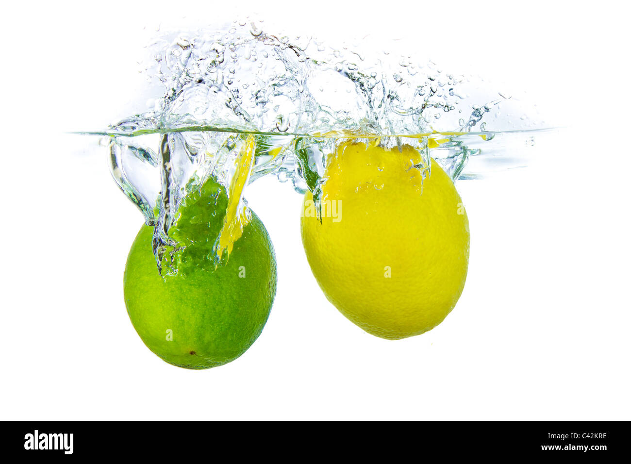 lime and lemon splashing water isolated on white background Stock Photo ...