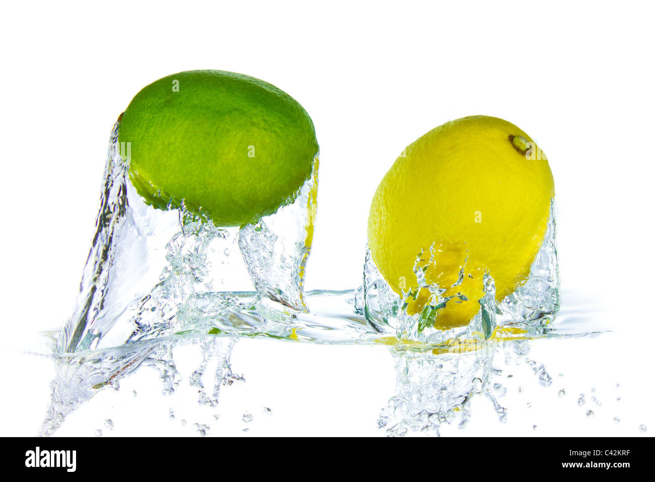 lime and lemon splashing water isolated on white background Stock Photo ...
