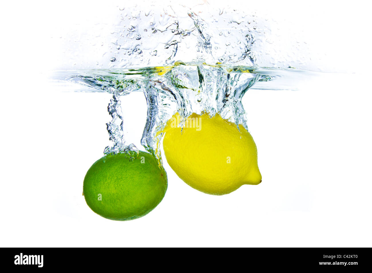 lime and lemon splashing water isolated on white background Stock Photo ...