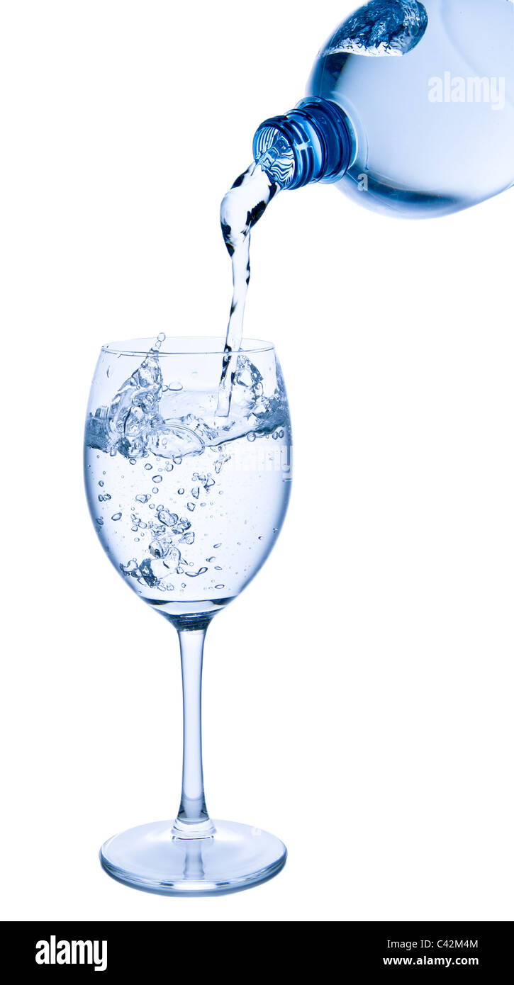 water pouring into glass on white background Stock Photo - Alamy
