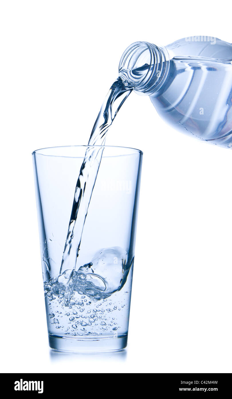 water pouring into glass on white background Stock Photo - Alamy