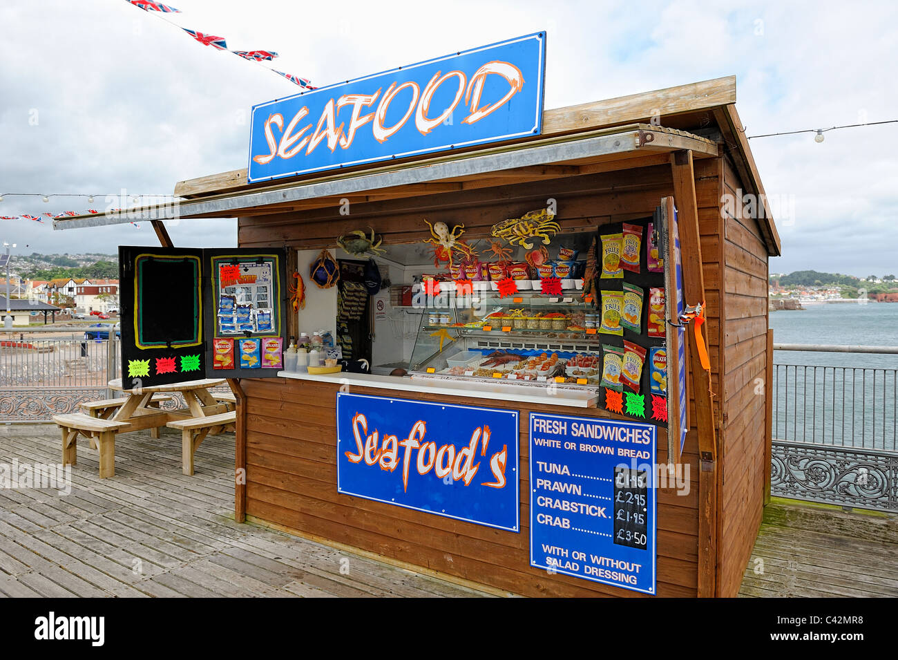 seafood stall on paignton pier devon england uk Stock Photo - Alamy