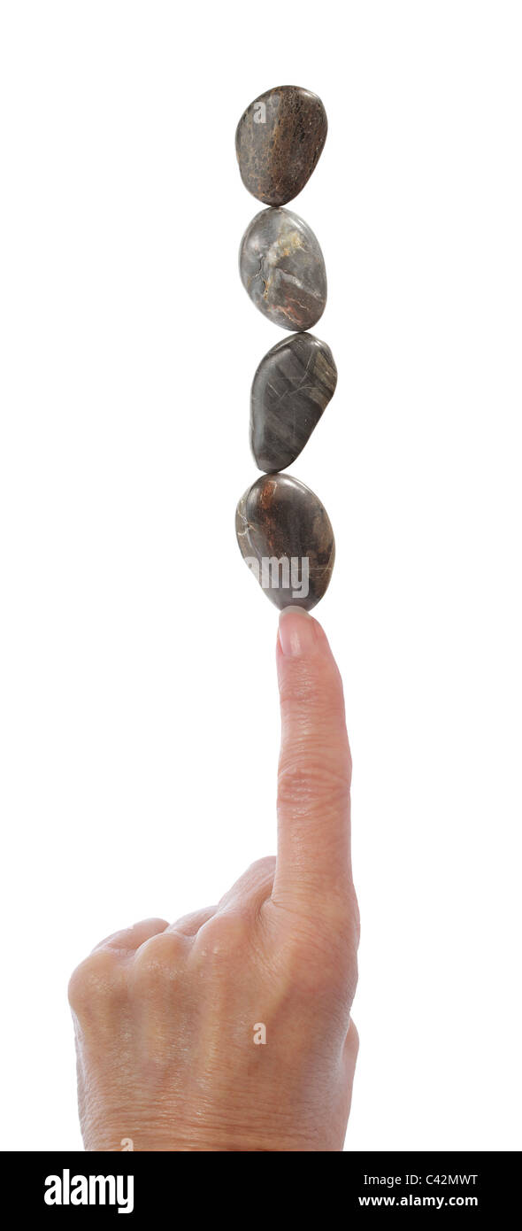 Hand Balance Stones on Finger Stock Photo - Alamy