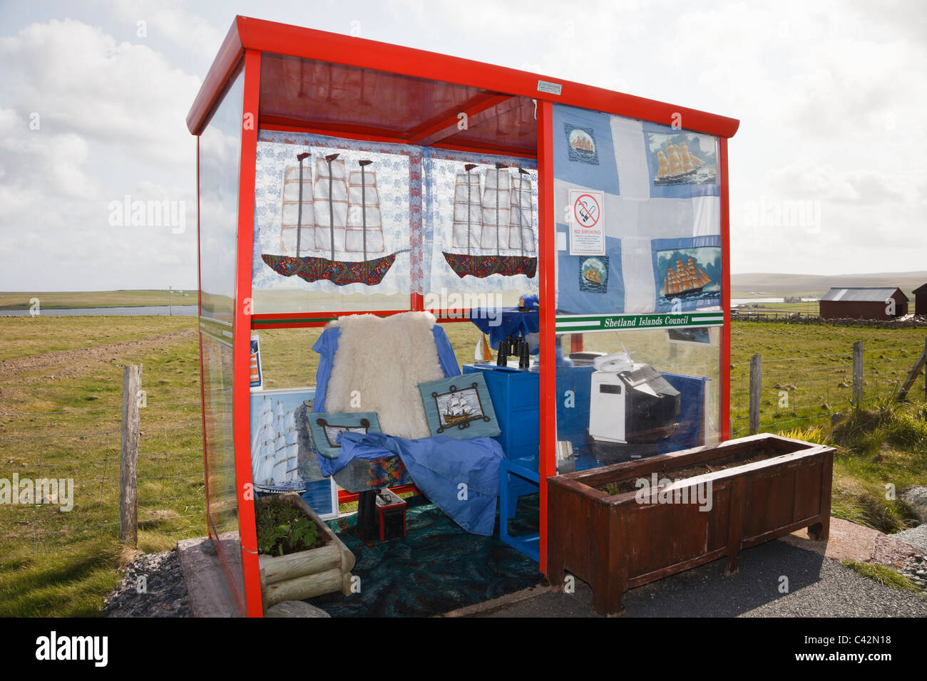 Rural bus stop shelter furnished and decorated with home comforts known ...
