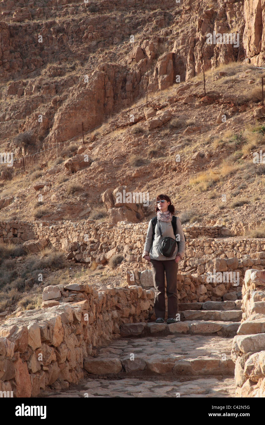 Traveller walks up to Mar Musa Monastery, Syria Stock Photo - Alamy
