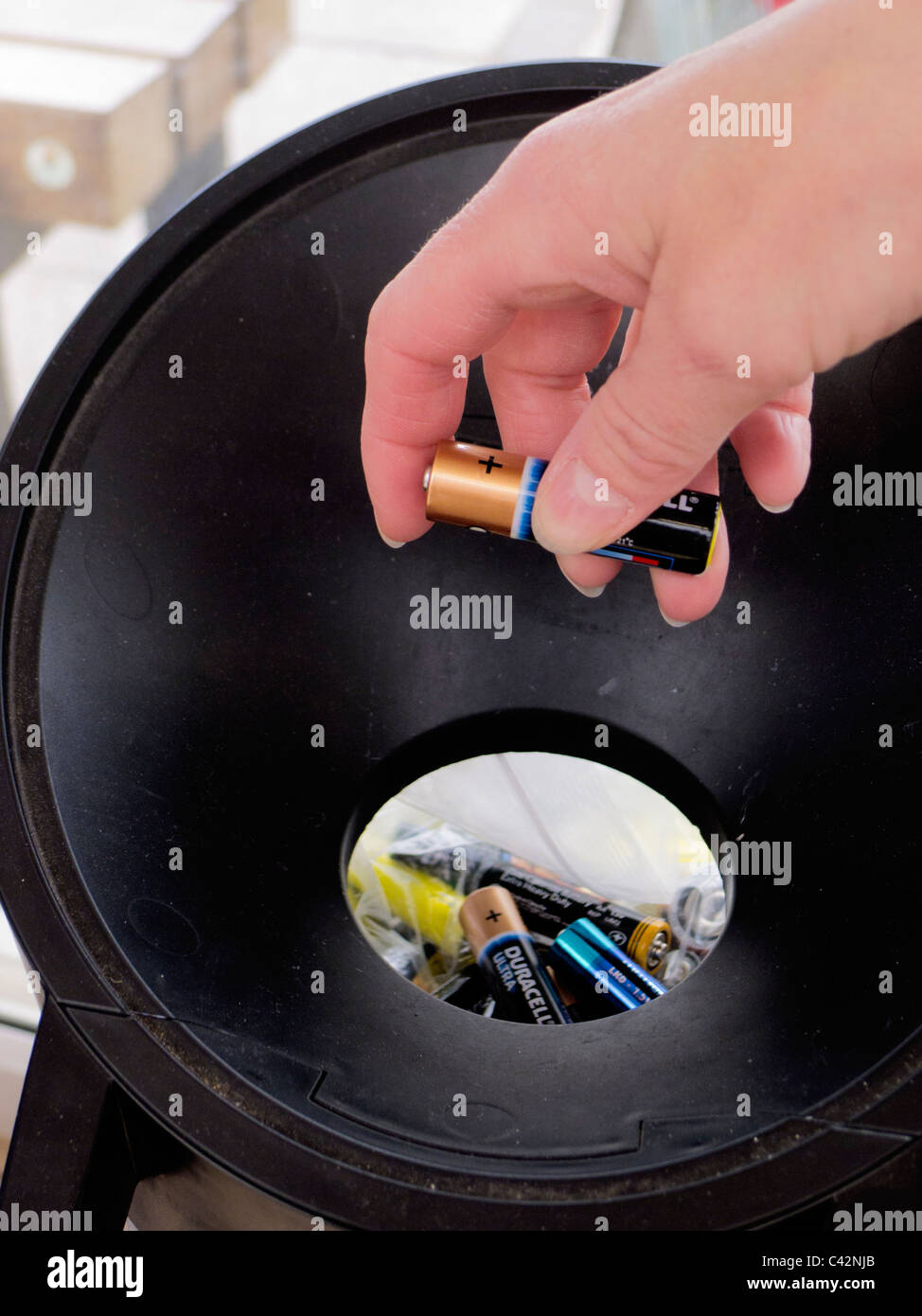 Battery recycling container in public shopping area Stock Photo - Alamy