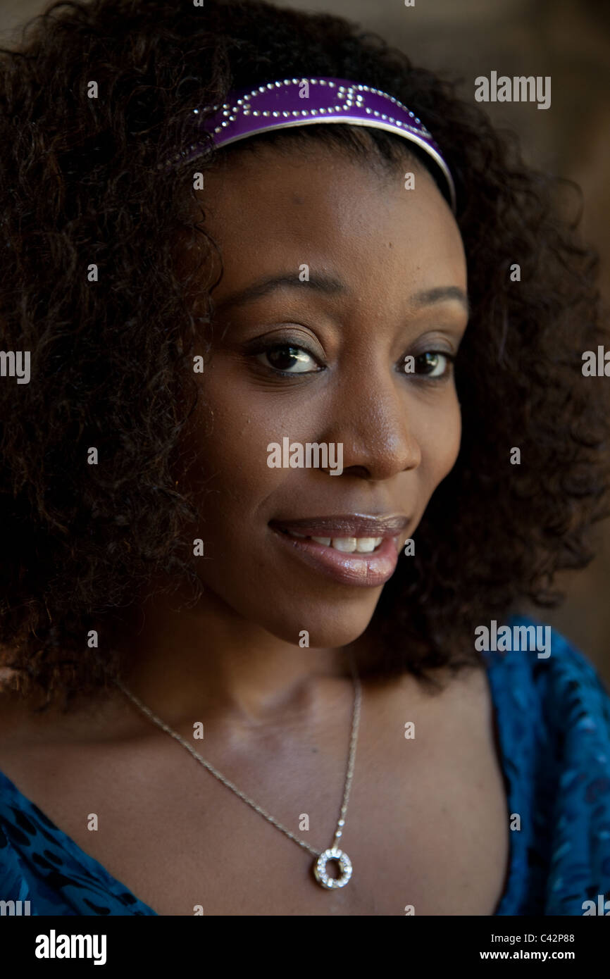 Lovely black woman with pleasing friendly smile Stock Photo - Alamy