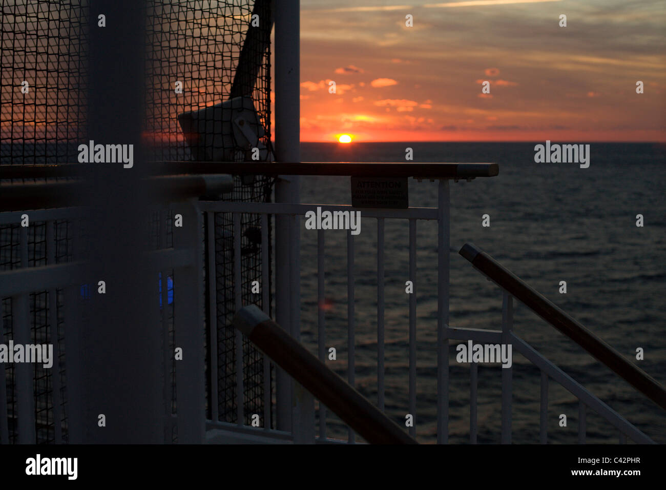 Sunset from a ship Stock Photo - Alamy