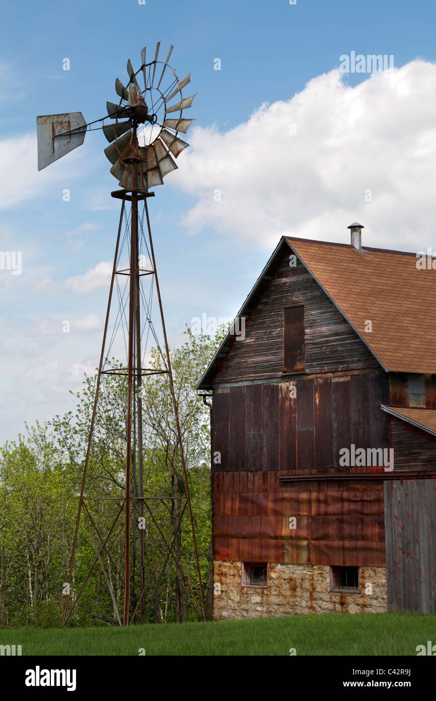 An old abandoned farm barn and windmill Stock Photo - Alamy