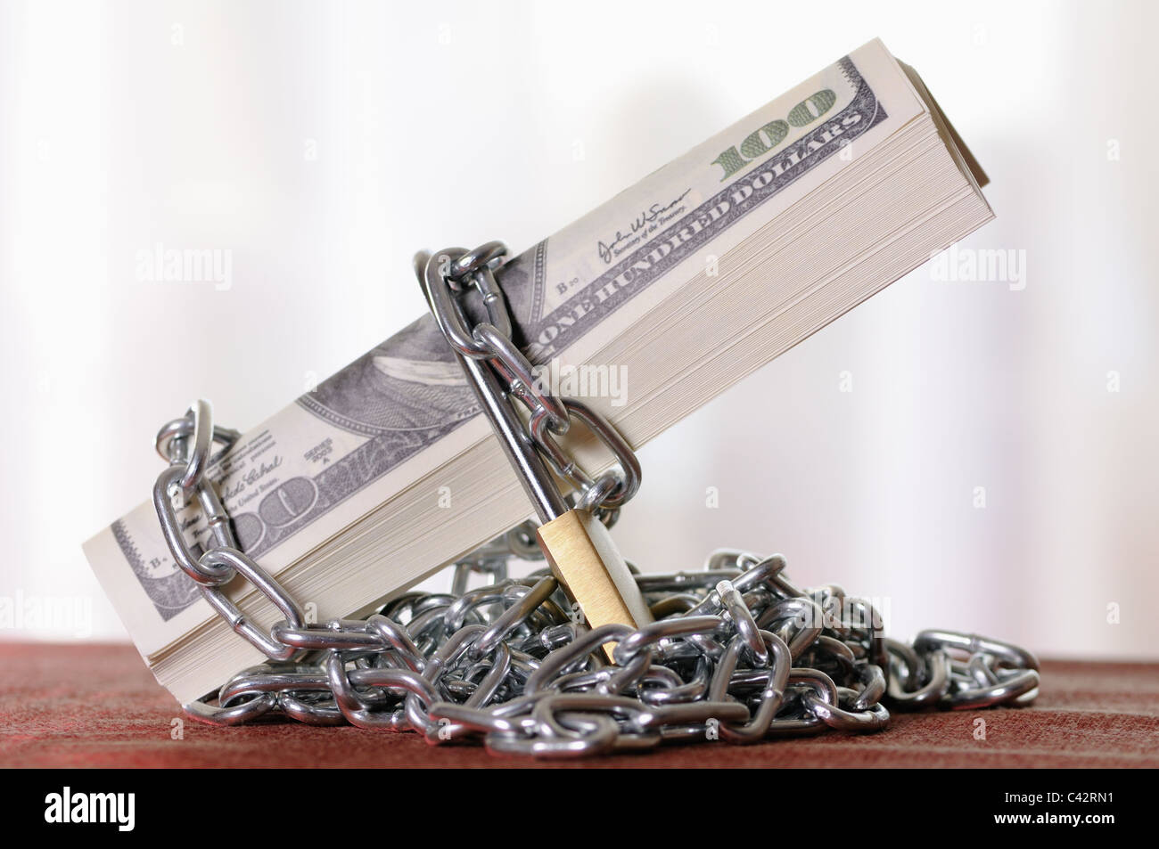 Dollars with a chain hi-res stock photography and images - Alamy