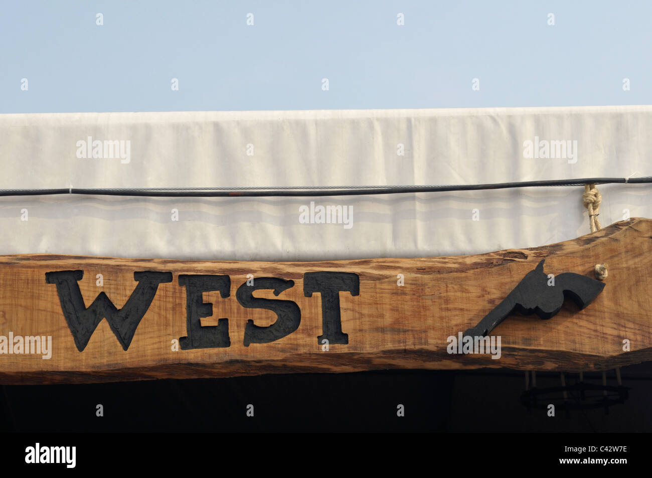 west sign and gun Stock Photo - Alamy
