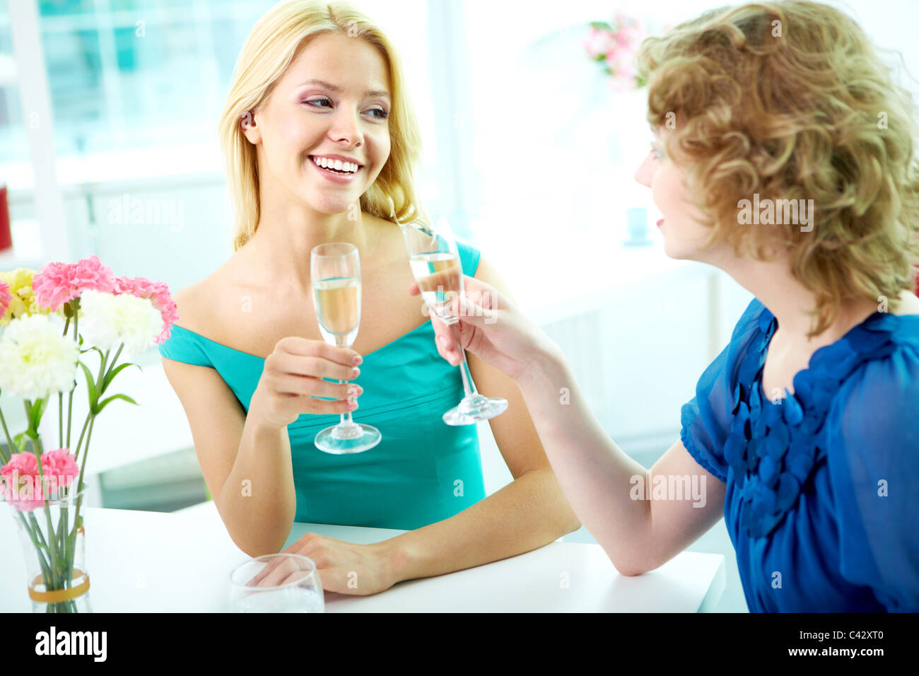 Gorgeous girls drinking alcohol on some occasion Stock Photo - Alamy