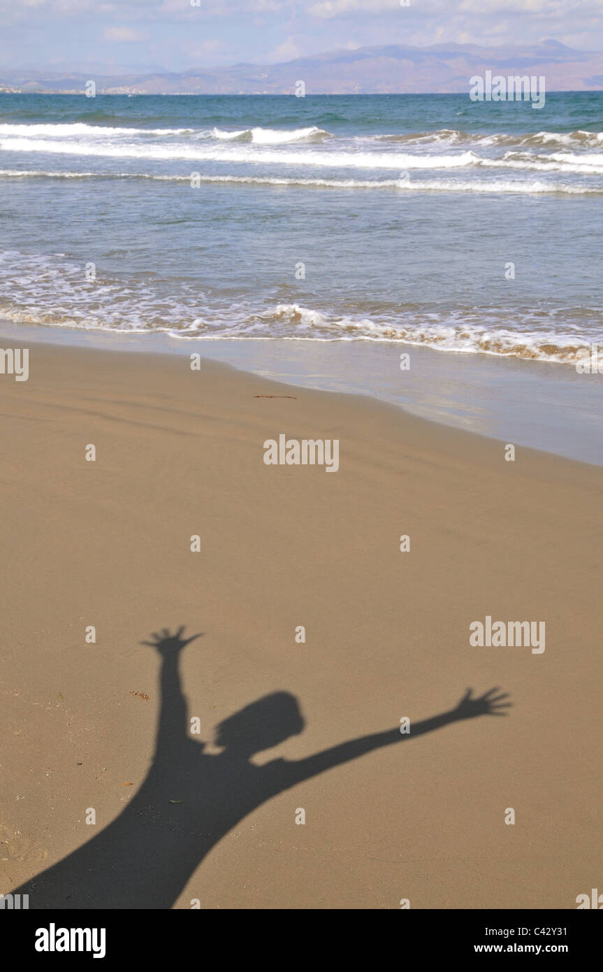 Shadow of a happy person on a tropical beach Stock Photo - Alamy