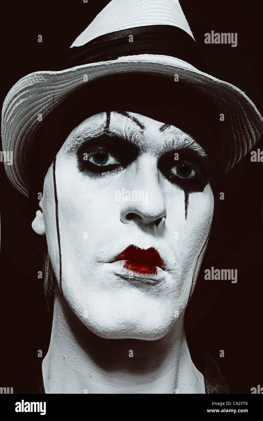 face of mime with dark make-up on black background closeup Stock Photo ...