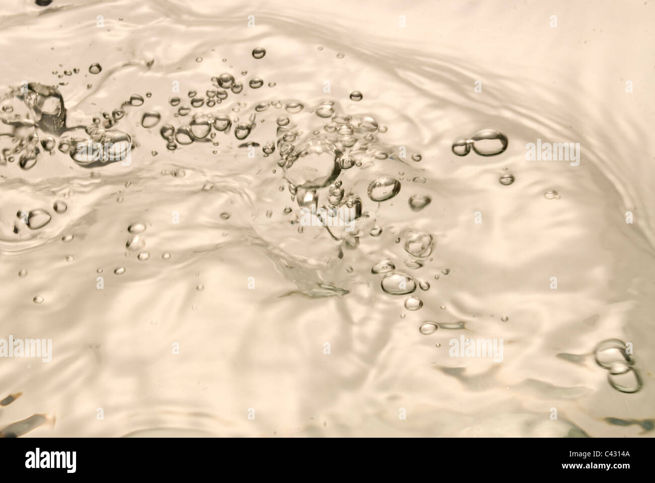 High speed flash photo of swirling water with bubbles Stock Photo - Alamy