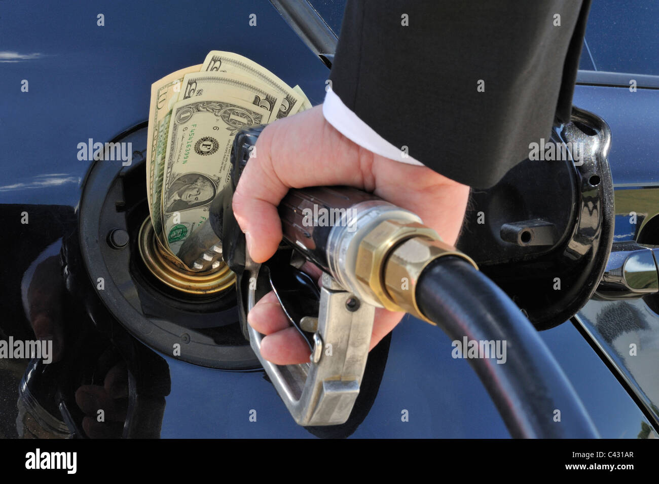 Banknotes in fuel tank hi-res stock photography and images - Alamy