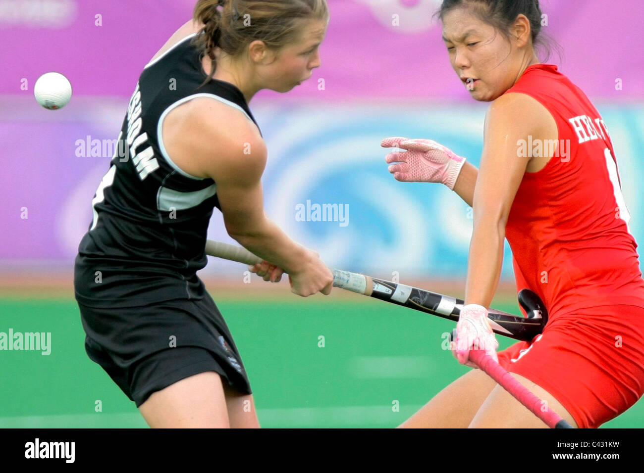 New Zealand's Jessica Chisholm(left) ends up poking South Korea's Heo ...
