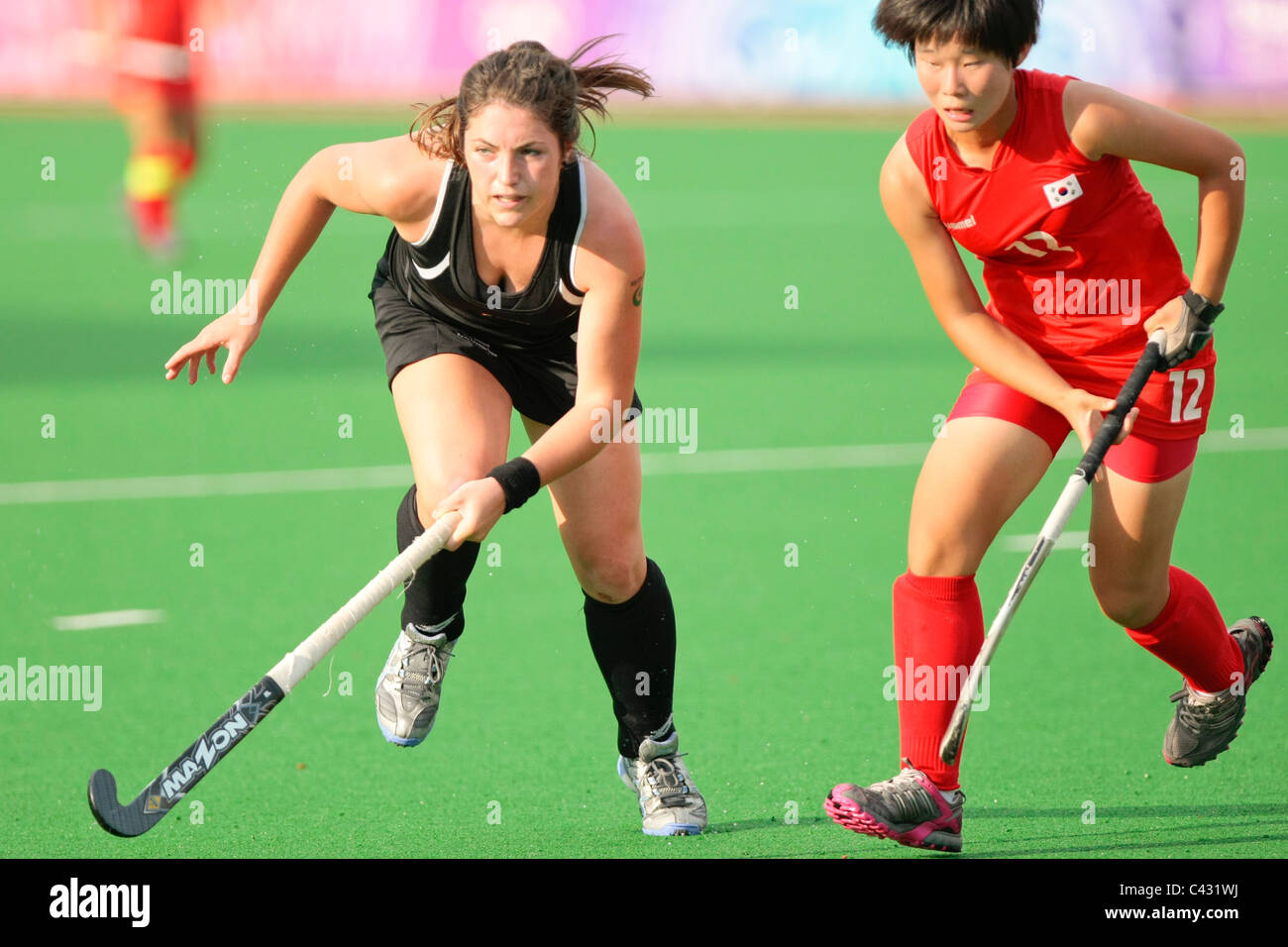 New Zealand's Danielle Sutherland(left) chases down the loose ball as ...
