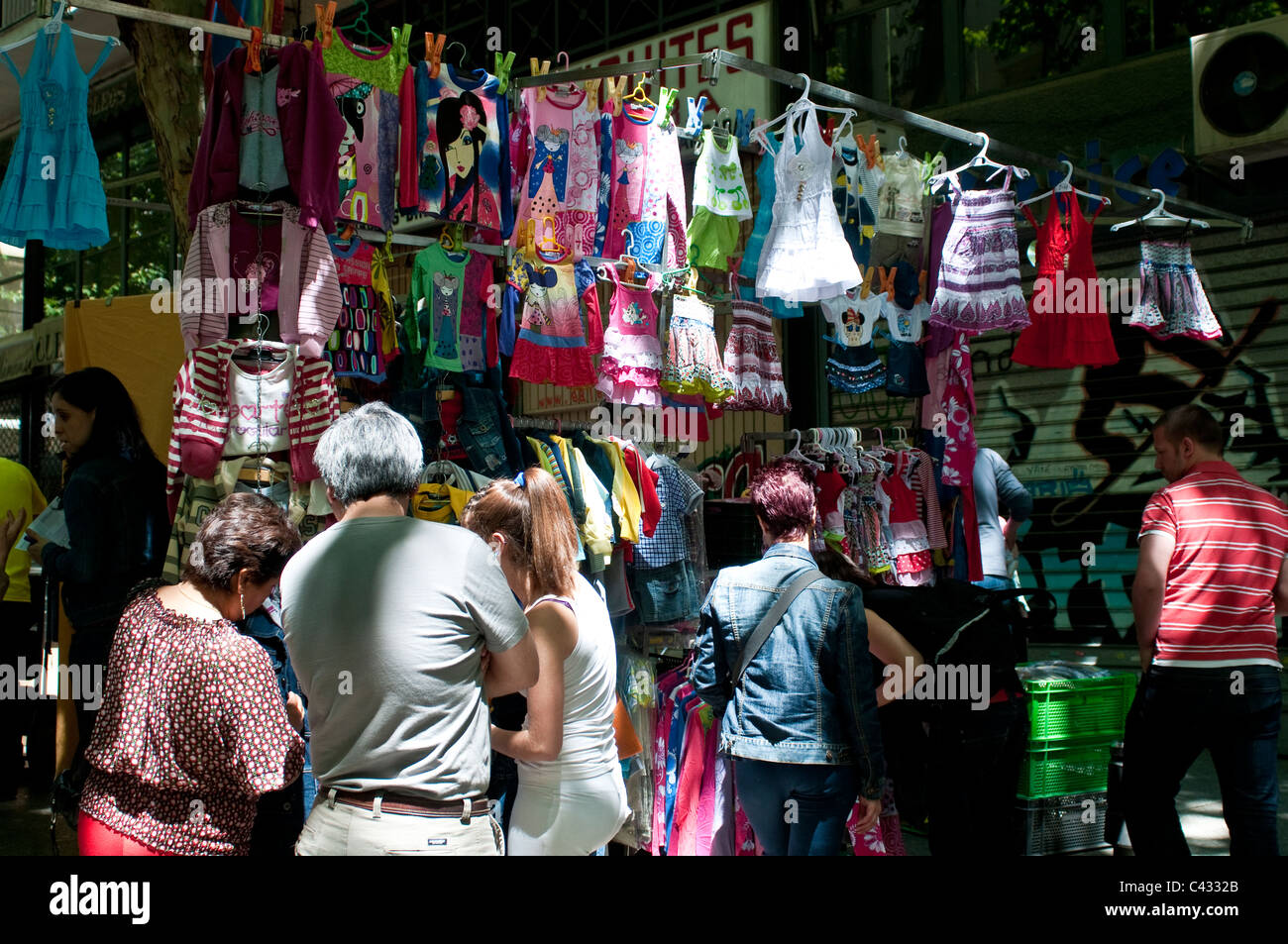 Children's clothes stall, El Rastro market, Madrid, Spain Stock Photo ...