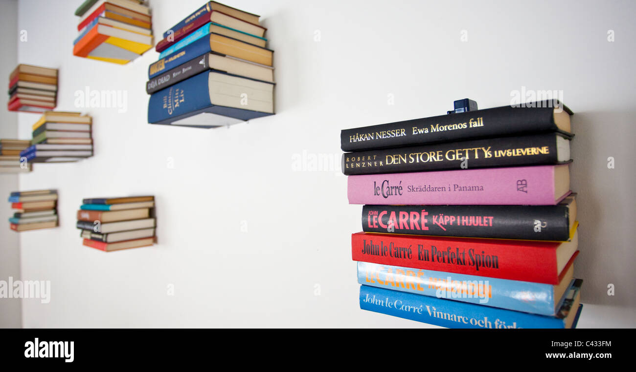Stacks of books on a wall Stock Photo - Alamy