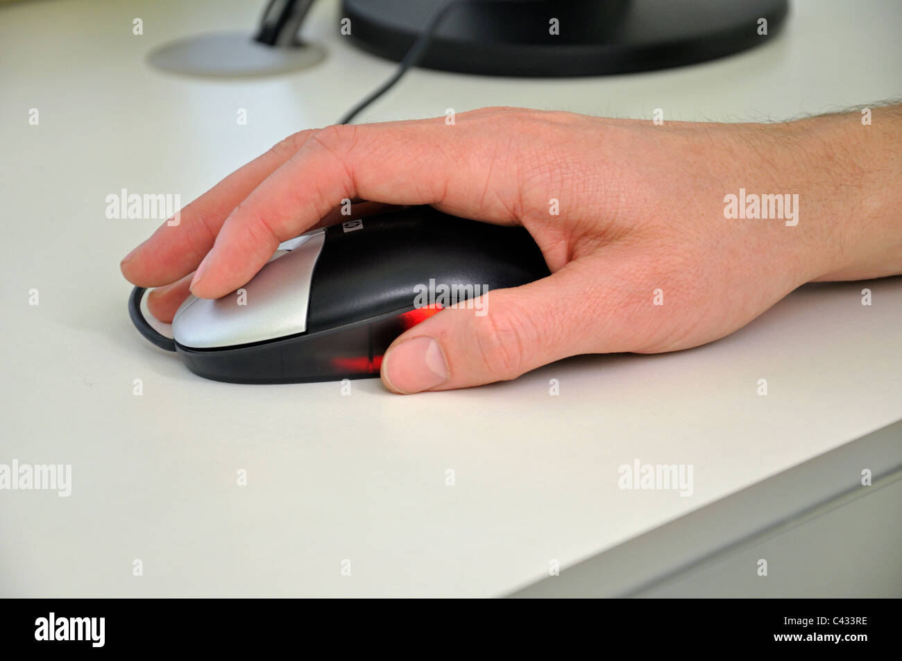 Hand on mouse of computer hi-res stock photography and images - Alamy