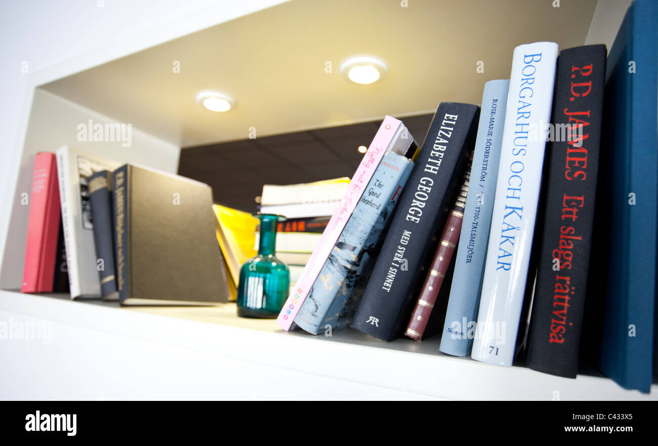 Group of books in a shelf Stock Photo - Alamy