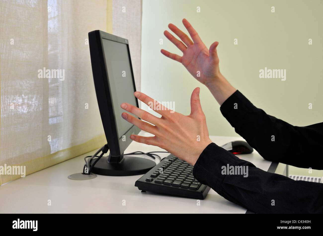 Frustrated businessman in front of computer focus on hands Stock Photo ...