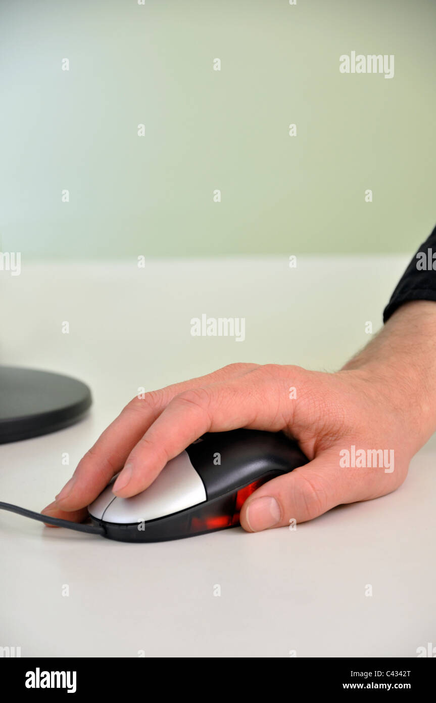 Hand on mouse of computer hi-res stock photography and images - Alamy