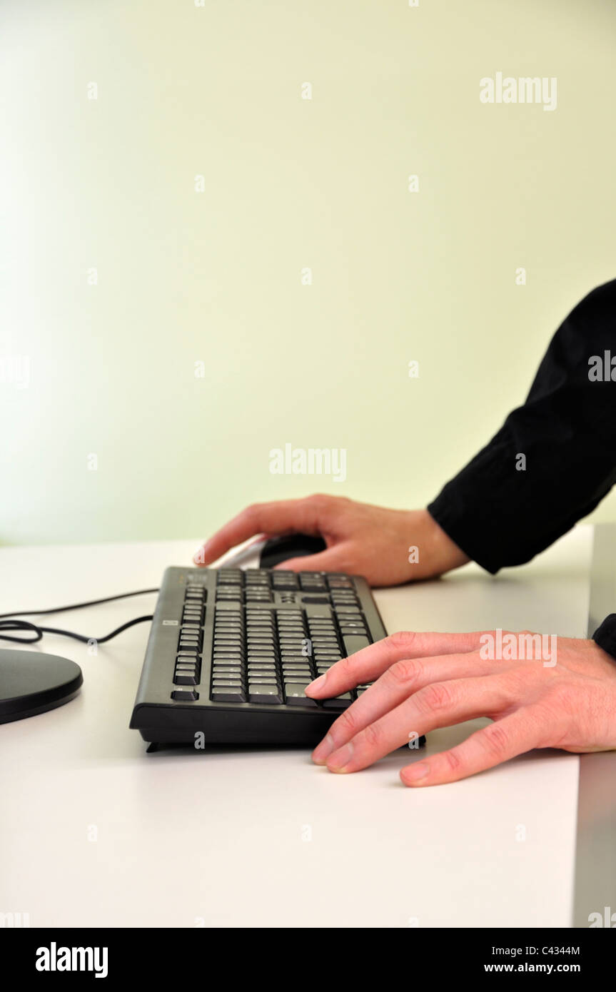Man typing on keyboard close-up Stock Photo - Alamy