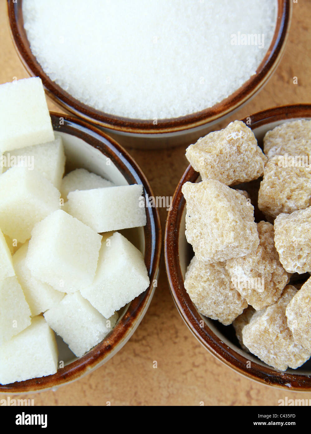 Several types of sugar - refined sugar, brown sugar and granulated ...