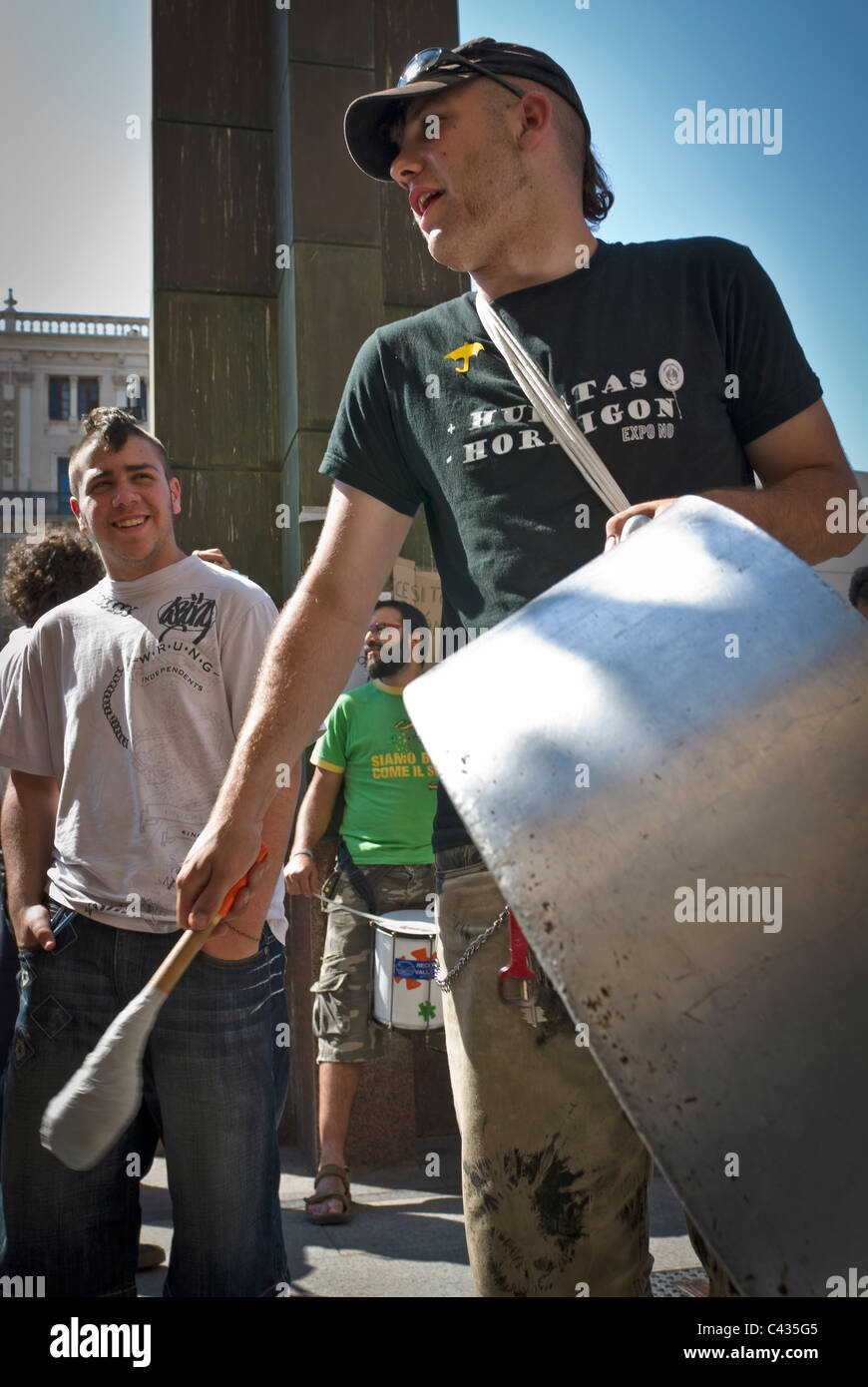 People making noise with pots and all sorts of kitchen equipment during ...