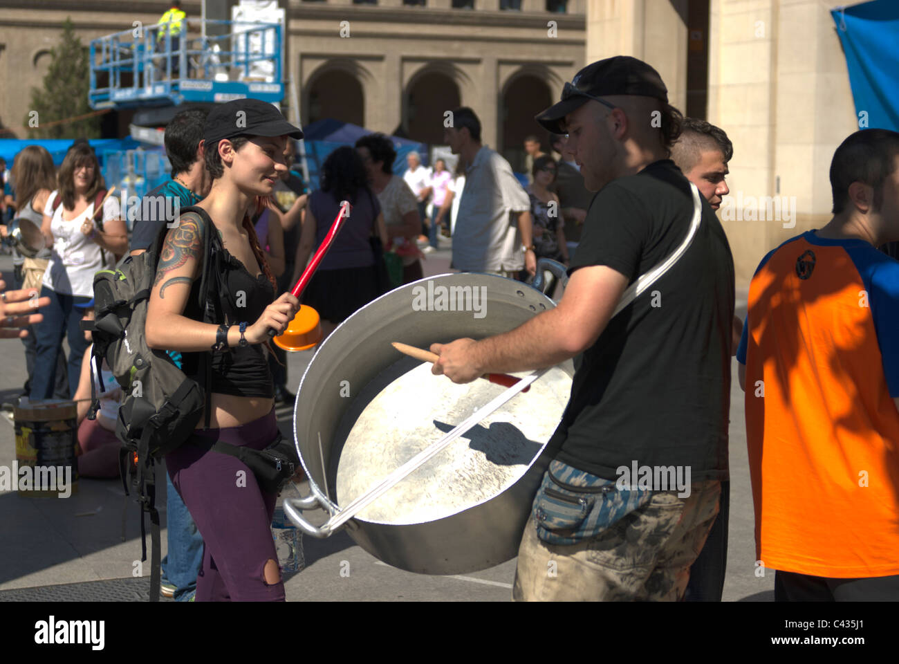 People making noise with pots and all sorts of kitchen equipment during ...