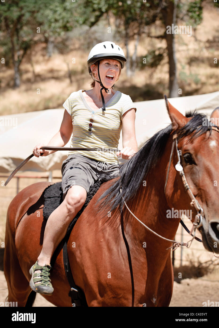 Woman riding a horse Stock Photo - Alamy