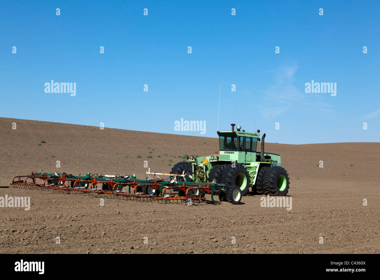 Bare soil and Steiger Panther tractor being prepared for a crop Palouse ...