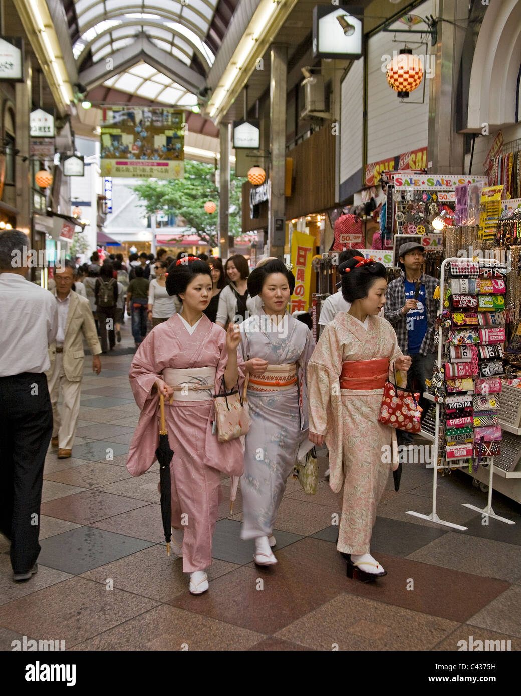 Traditionally-clad Japanese women in a covered shopping mall Stock ...