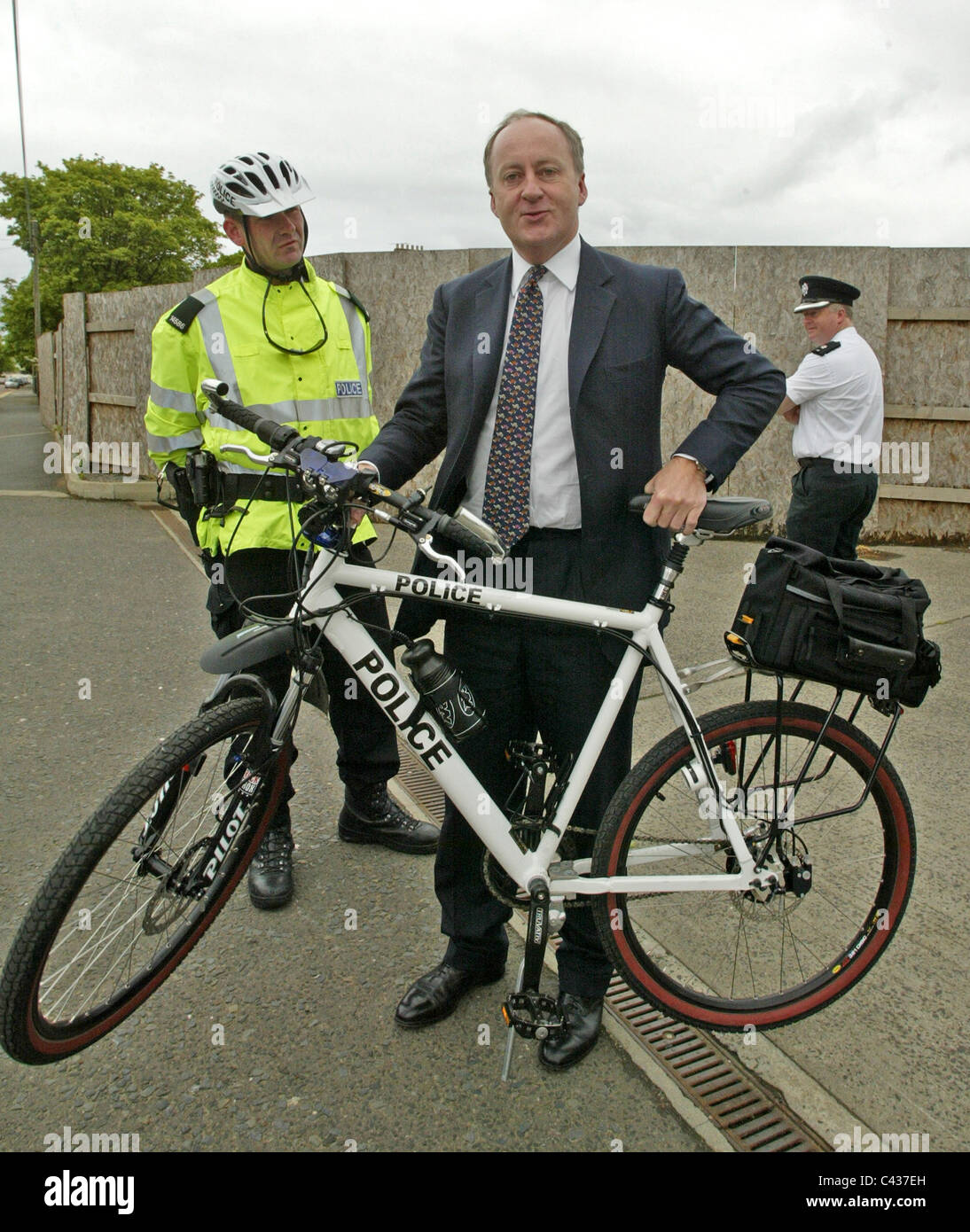 Northern Ireland Security Minister Shaun Woodward MP, looks over ...