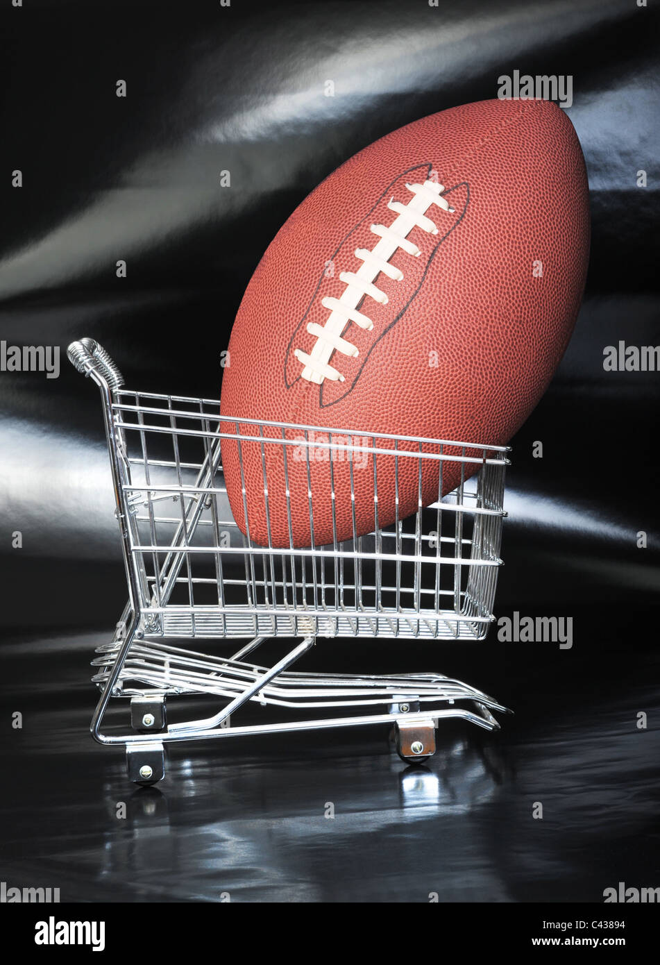 Football in a shopping cart Stock Photo - Alamy