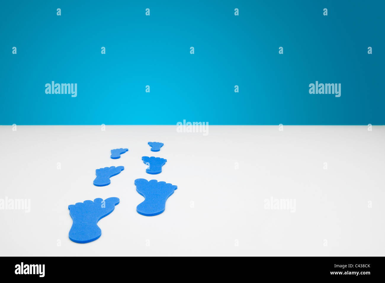 Close up of Blue foam Footprints Stock Photo - Alamy
